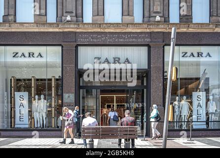 Masked customers queue to enter ZARA Fashion Store in Donegall Place ...