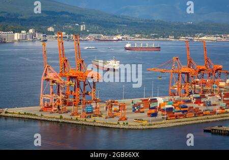 Cargo ships are loading and unloading containers in an orderly manner ...
