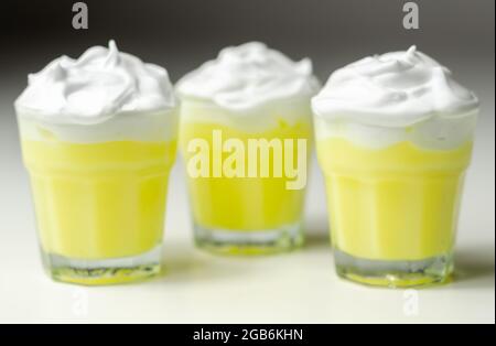 Three shot drinks on base of Bombardino with creamy whipped cream ...