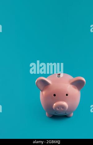 red piggy bank on blue panorama background Stock Photo - Alamy