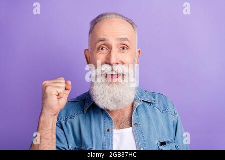 Photo of shocked lucky age gentleman wear jeans shirt rising fist ...