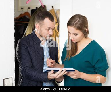 Caseworker helping woman polling questionnaire Stock Photo - Alamy