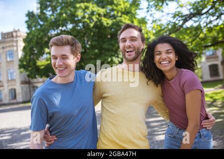 Three friends spending time together Stock Photo - Alamy