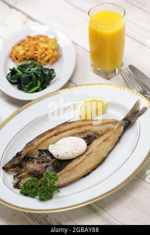 kipper(smoked herring) and poached egg, traditional British breakfast ...