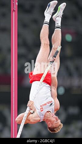 Piotr Lisek of Poland in action in the men's pole vault competition ...