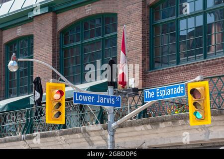 Jarvis Street sign with traffic light is seen in downtown Toronto ...