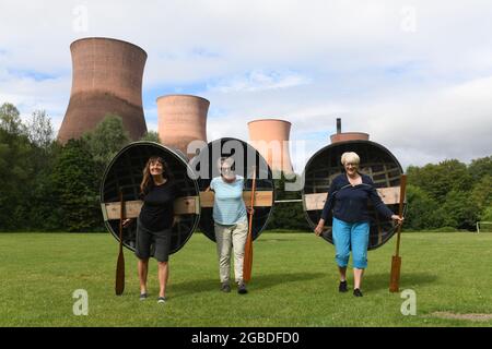 Members of the Ironbridge Coracle Society carrying their coracles from ...