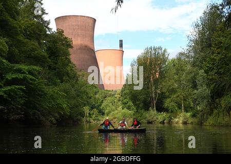 Ironbridge Coracle Society ladies paddling coracles on the River Severn ...