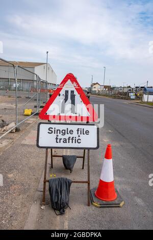 Single file traffic ahead road sign Stock Photo - Alamy
