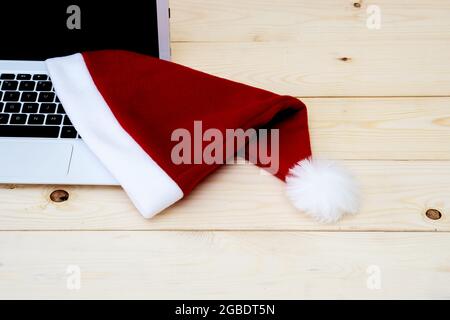 laptop with blank screen and Santa Slaus hat Stock Photo - Alamy