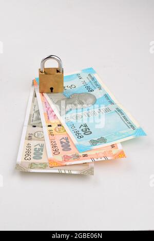 Indian currency note with lock isolated on white background, money ...