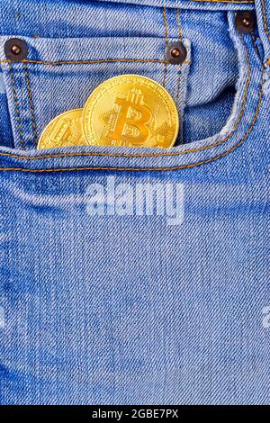 Bitcoin in jeans pocket Stock Photo - Alamy