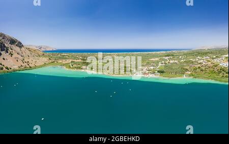 Panoramic aerial view of a huge freshwater lake surrounded by tall ...