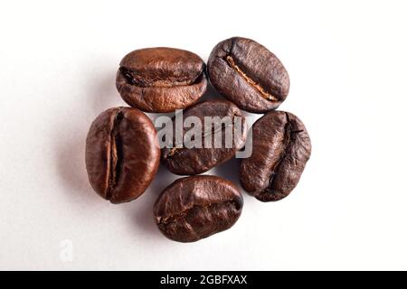 Roasted coffee beans top view, closeup image, space for text Stock ...