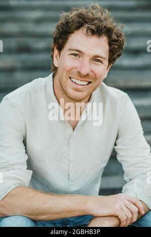 Young redhead man smiling confident standing with arms crossed gesture ...