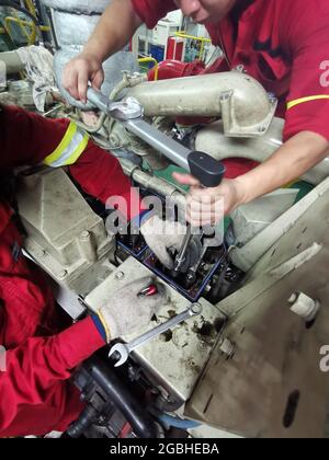 marine engineering crew carried out checking tappet clearance for ...