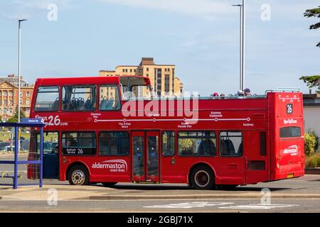 08-04-2021 Portsmouth, Hampshire, UK A group of teens at a bus stop ...