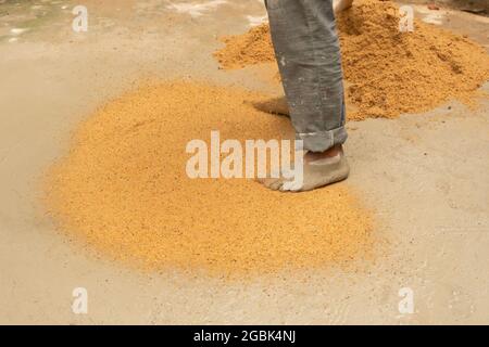 Indian construction labour separated sand and gravel manually using a ...