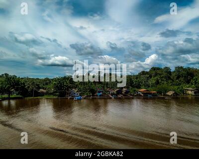 Riverfront town along the Amazon River, showing the custom and life of ...