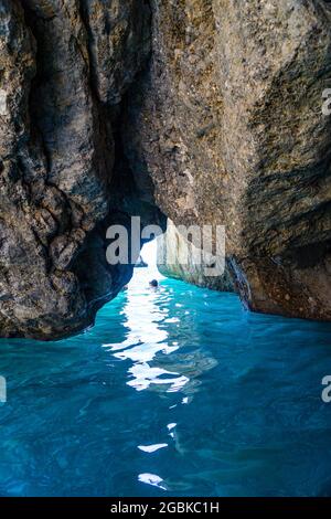 sea cave at Foneas beach near Kardamyi, West coast of Greece Stock ...