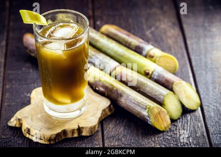 Sugar cane juice or garapa, drink rich in sucrose, cold drink typical ...
