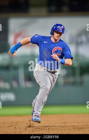 Chicago Cubs' Ian Happ (8) runs the bases after hitting a double during ...