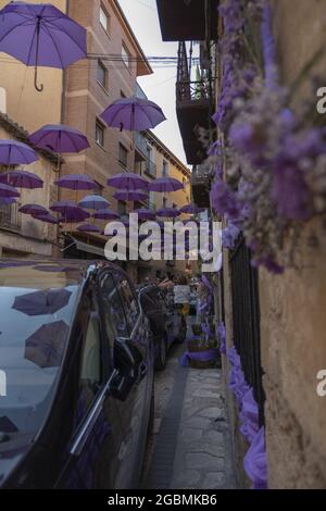 BRIHUEGA, SPAIN - Jul 10, 2021: A low-angle shot of purple umbrellas ...