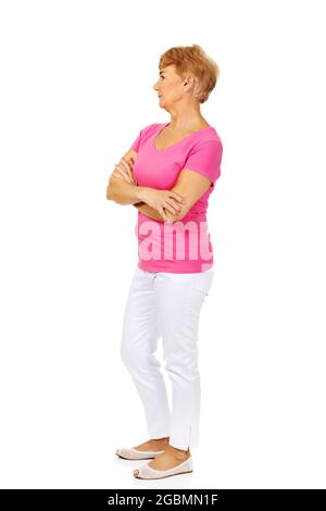 Full body shot of an old Polish woman in pain holding her aching back ...