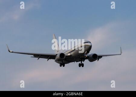 A US Navy Boeing C40A Clipper military transport aircraft flying near ...