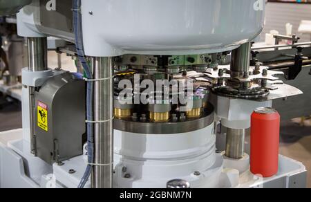 High speed can seamer machine. Tin can sealing machinery. Food industry ...