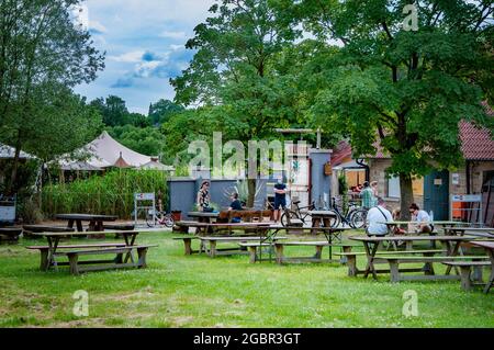 BIELEFELD, GERMANY. JUNE 20, 2021 Loheide park People ride bicycles ...