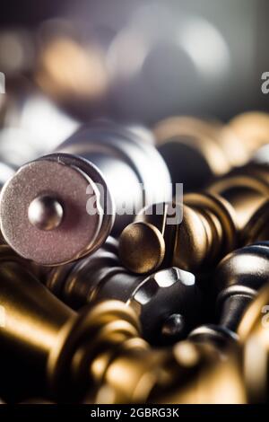 Vertical closeup of golden chess figures on dark background Stock Photo ...