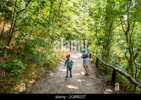 MOSINA, POLAND - Jul 24, 2021: A woman walking on a footpath along with ...