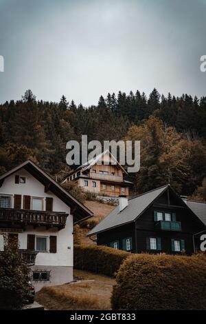 Vertical Exterior view of houses with balconies and built on a hill ...