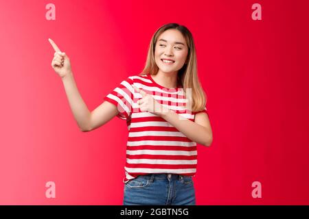 Happy relaxed good-looking outgoing modern urban korean blond girl turn ...