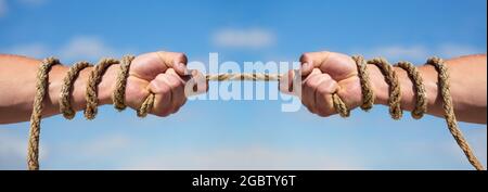 two hands pulling a rope. Rescue, help, helping gesture or hands. Conflict tug of war Stock ...