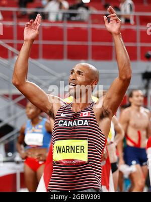 Damian Warner, of Canada reacts after finishing the decathlon 100 ...