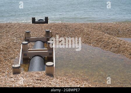 Drainage pipe outfall on beach Stock Photo - Alamy