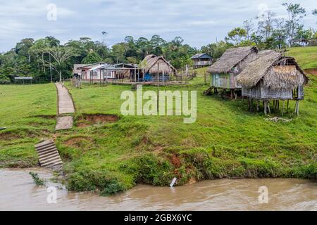 Small village in a peruvian jungle along Napo river Stock Photo - Alamy