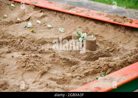 Empty Children's sandbox with a crafts and flowers, Russia Stock Photo ...