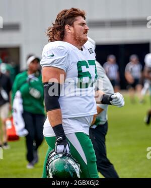 New York Jets' Dan Feeney warms up before an NFL football game against ...