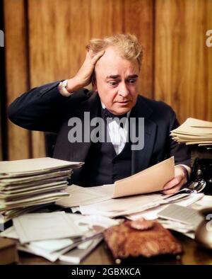 Portrait of overworked senior businessman sitting in office, geometric ...