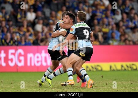 Wade Graham of the Sharks is tackled during the round 16 NRL match ...