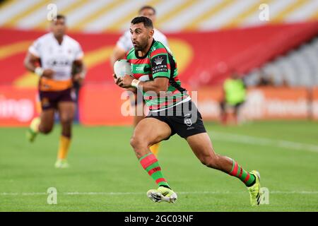 Alex Johnston of the Rabbitohs runs with the ball to score a try during ...