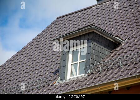 New tiled roof with slate cladded chimney Stock Photo - Alamy