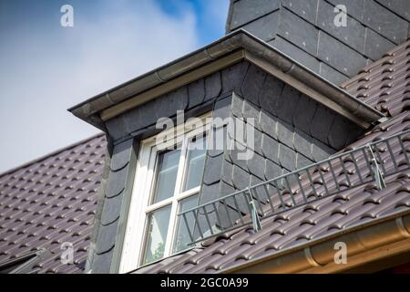 New tiled roof with slate cladded chimney Stock Photo - Alamy