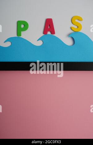 Word PAS with colorful letters on a white background with sea waves ...
