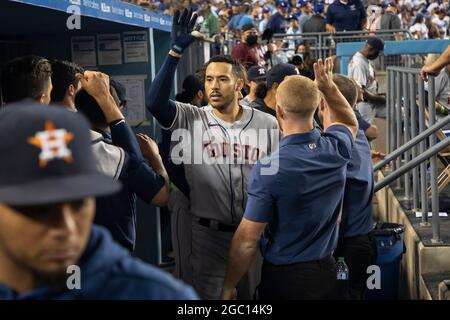 Houston Astros' Carlos Correa (1) hits an RBI single during the 10th ...
