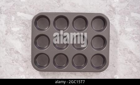 Flat lay. Step by step. Lining the baking pan with cooking foil to make ...