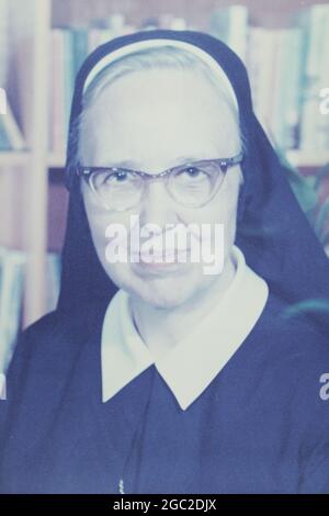 Catholic Nun wearing traditional habit clothing walking along the ...